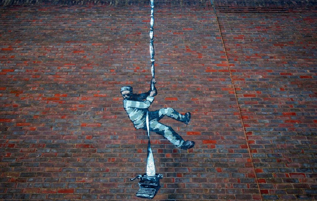 Name of Banksy's late rival sprayed on Reading Prison mural