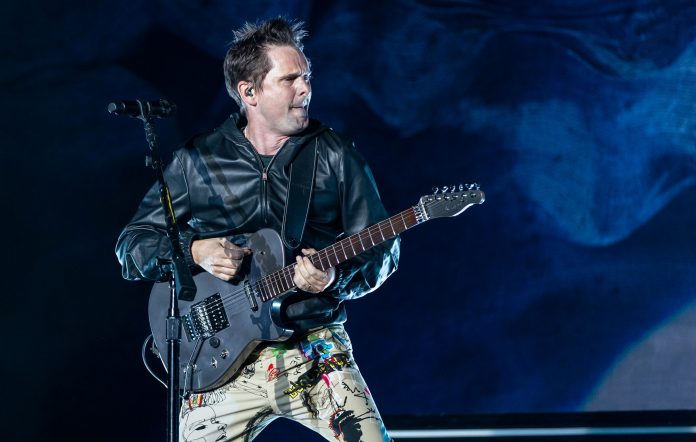 Watch Muse's Matt Bellamy smash guitar and gift to fan at O2 show